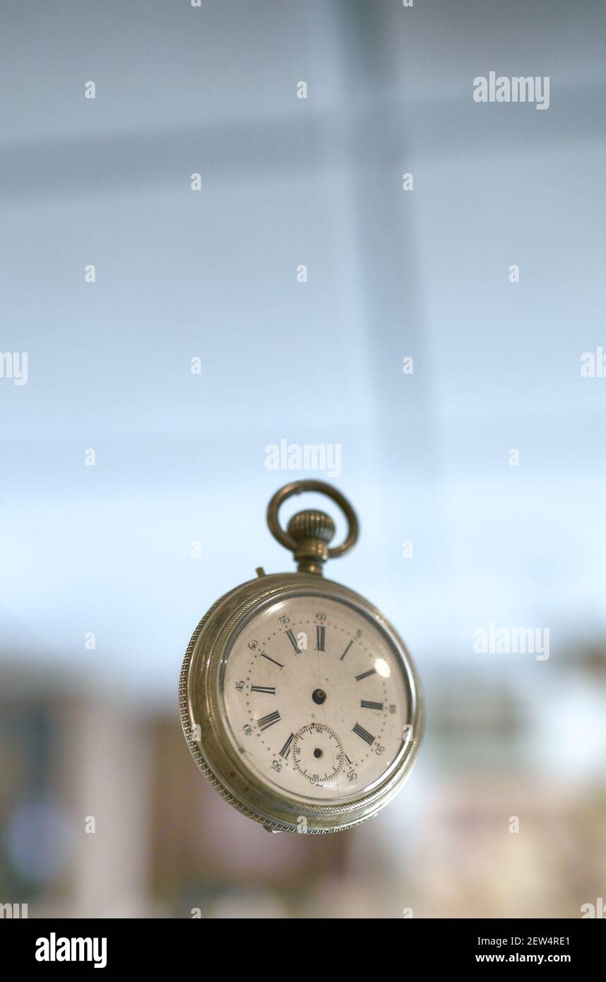 Gold pocket watch floating in the air with light background Stock Photo ...