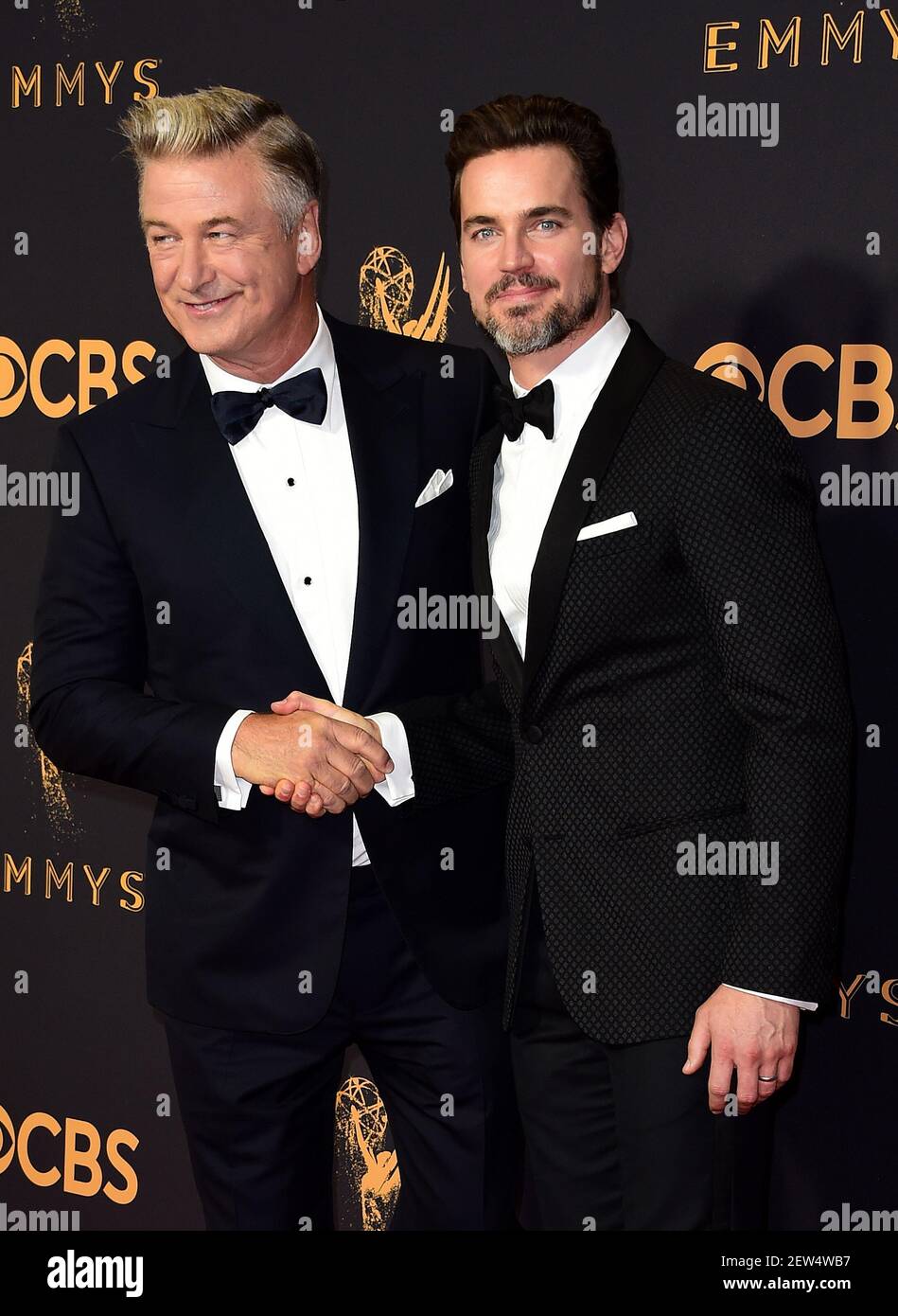 LOS ANGELES, CA - SEPTEMBER 17: Alec Baldwin (L) and Matt Bomer arrive at the 69th Emmy Awards ...