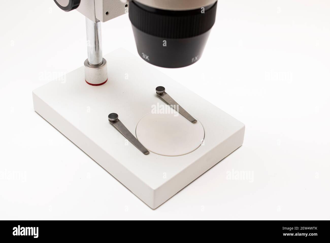 Large metal microscope on a white background Stock Photo - Alamy