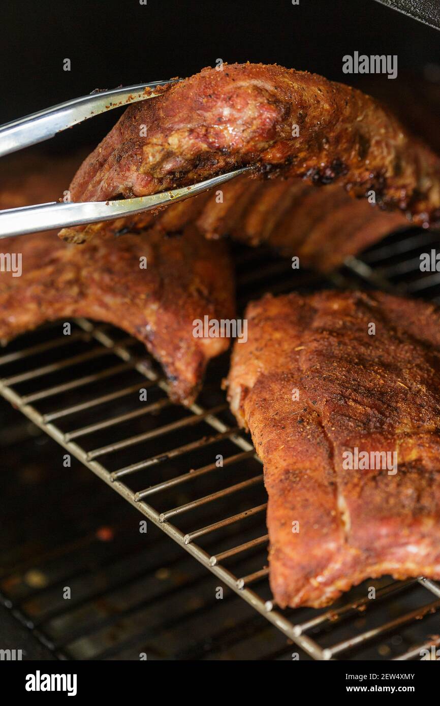 Beef Ribs Cooking on Barbecue Grill. Backyard BBQ party concept Stock ...