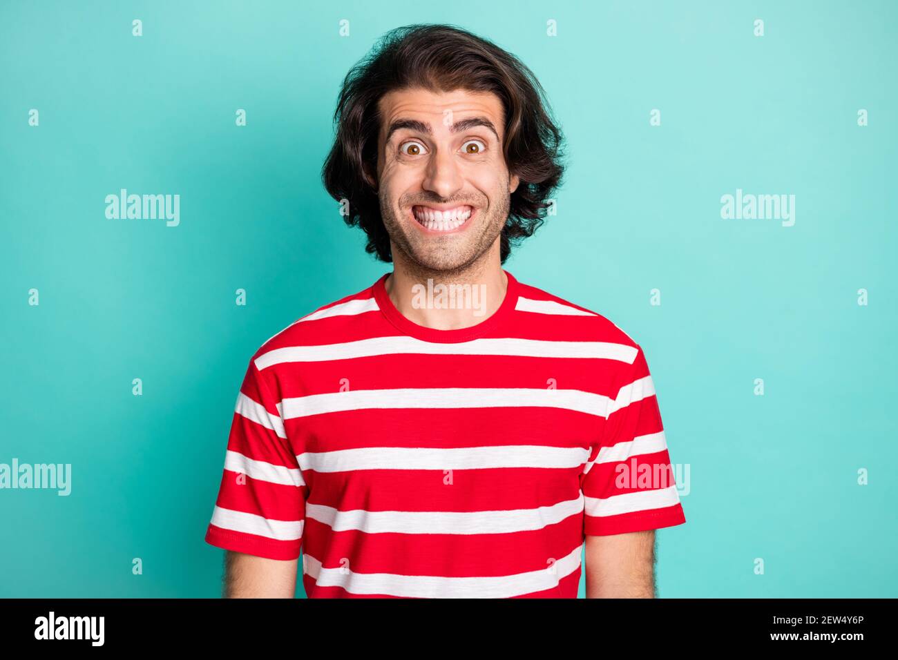 Portrait of nice cheerful funky brown-haired guy smiling sincerely ...