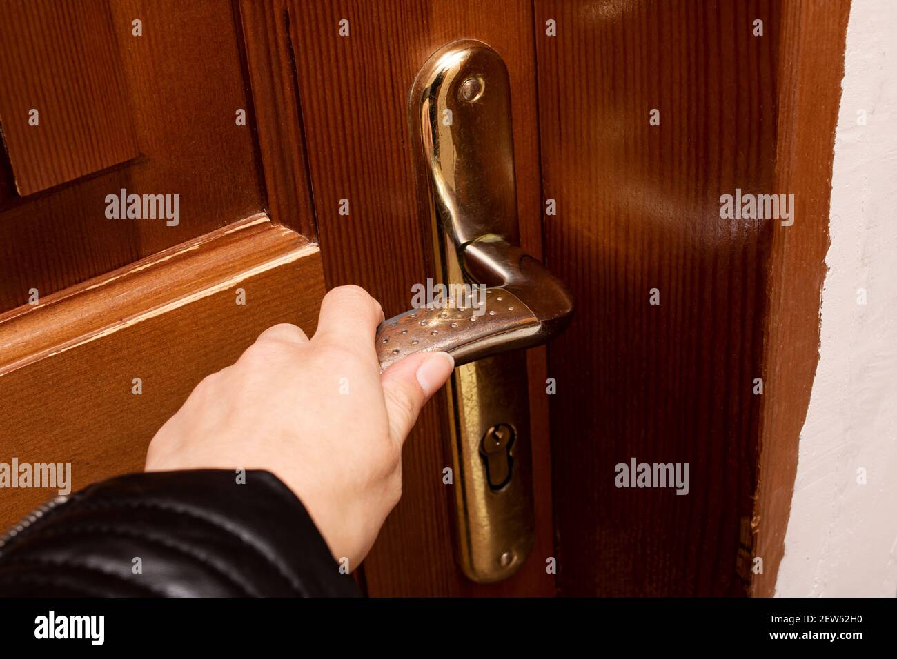 White window handle on a closed door Stock Photo - Alamy