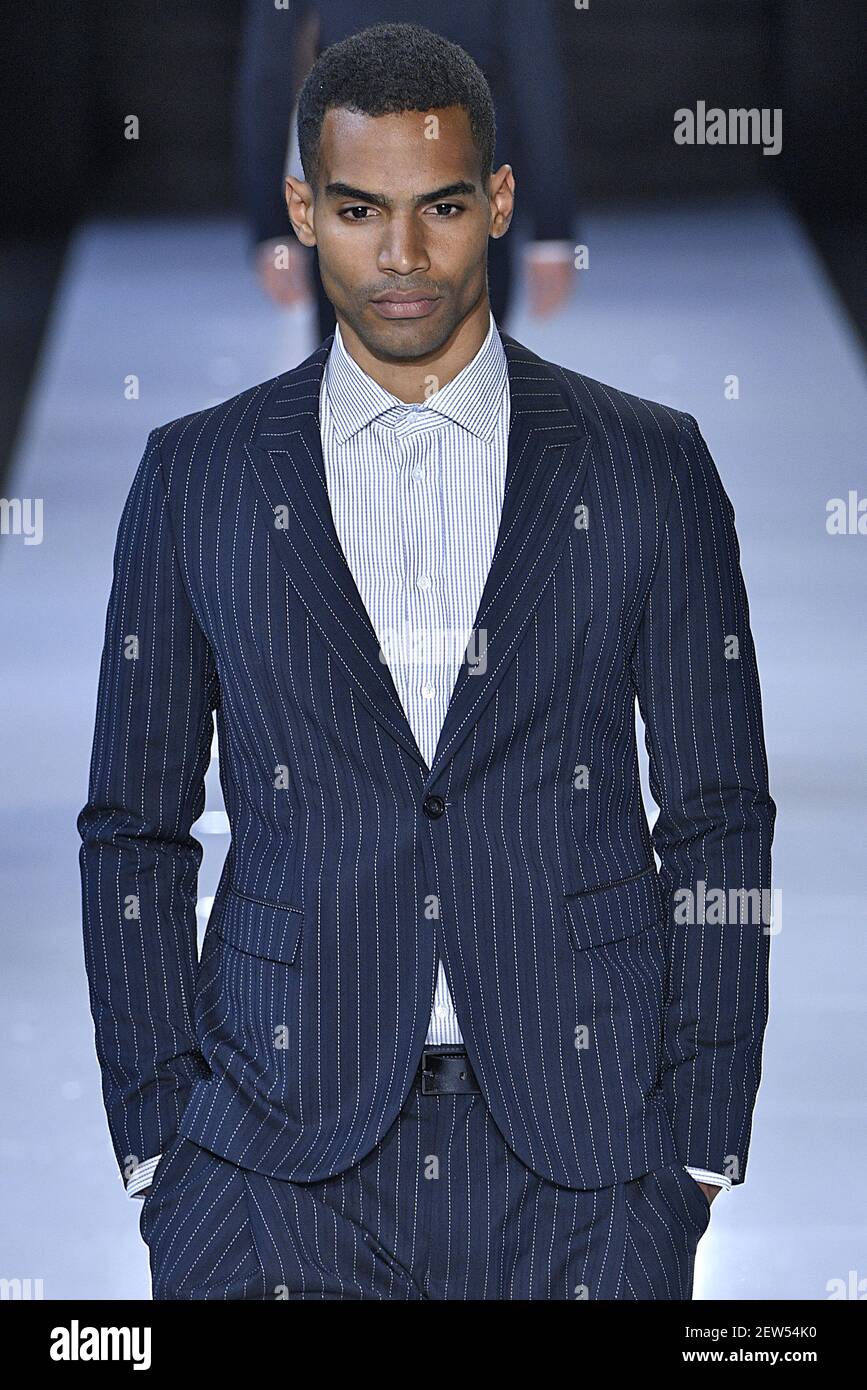Model Anthony Agapit walks on the runway during the Emporio Armani ...