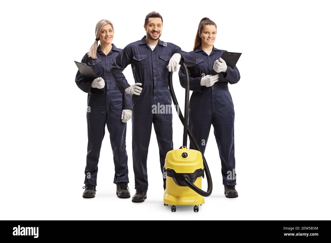 Team of cleaning workers with a vacuum cleaner isolated on white ...