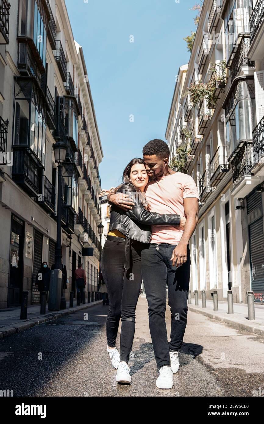 Young couple having romantic moments together in the street ...
