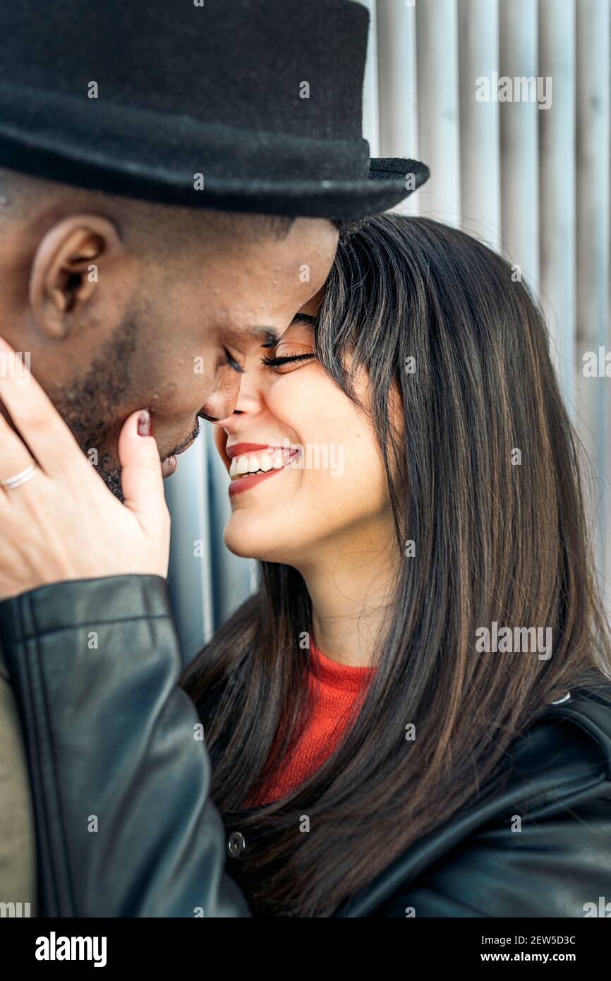 Young couple having romantic moments together in the street ...