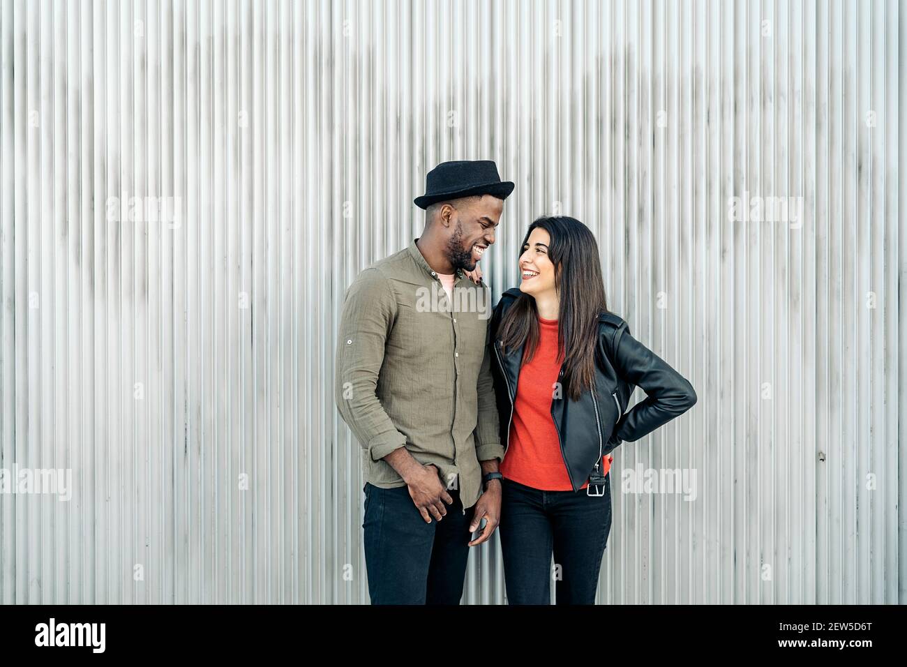 Attractive mixed ethnicity couple, they are looking at each other Stock ...