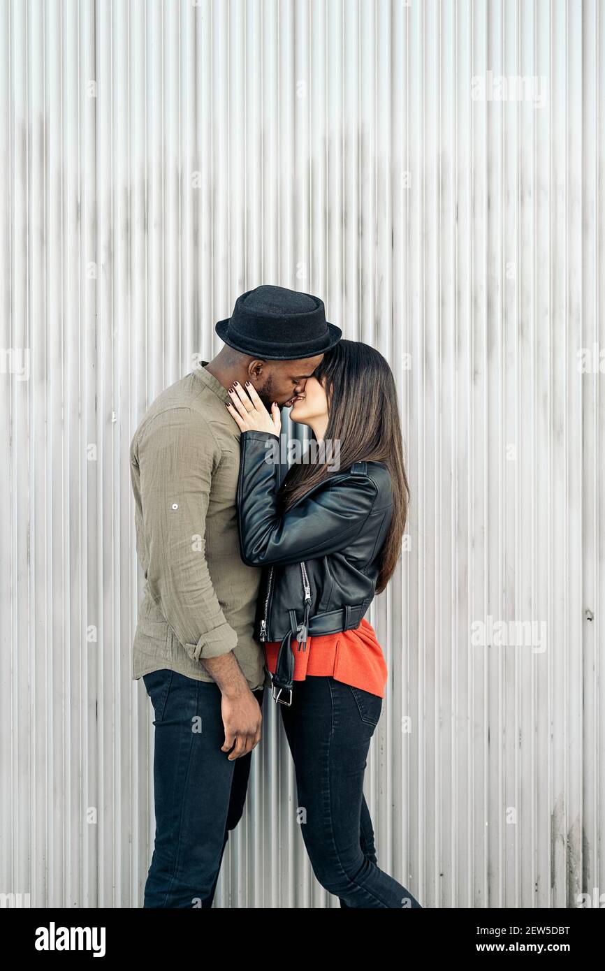 Young couple having romantic moments together in the street ...