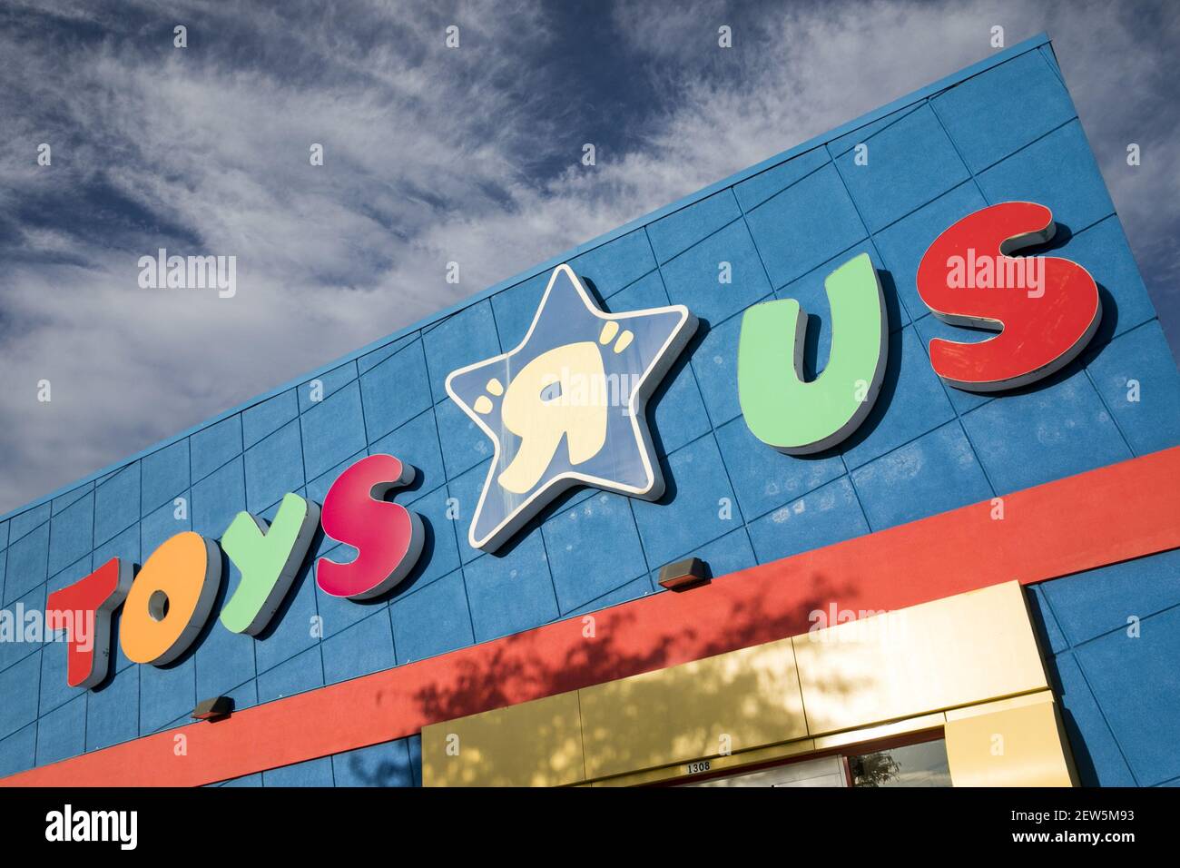 A logo sign outside of a Toys "R" Us retail store in Frederick ...