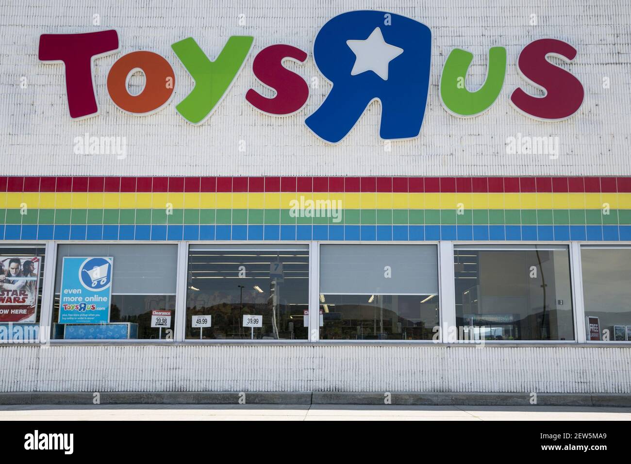 A logo sign outside of a Toys "R" Us retail store in Altoona ...