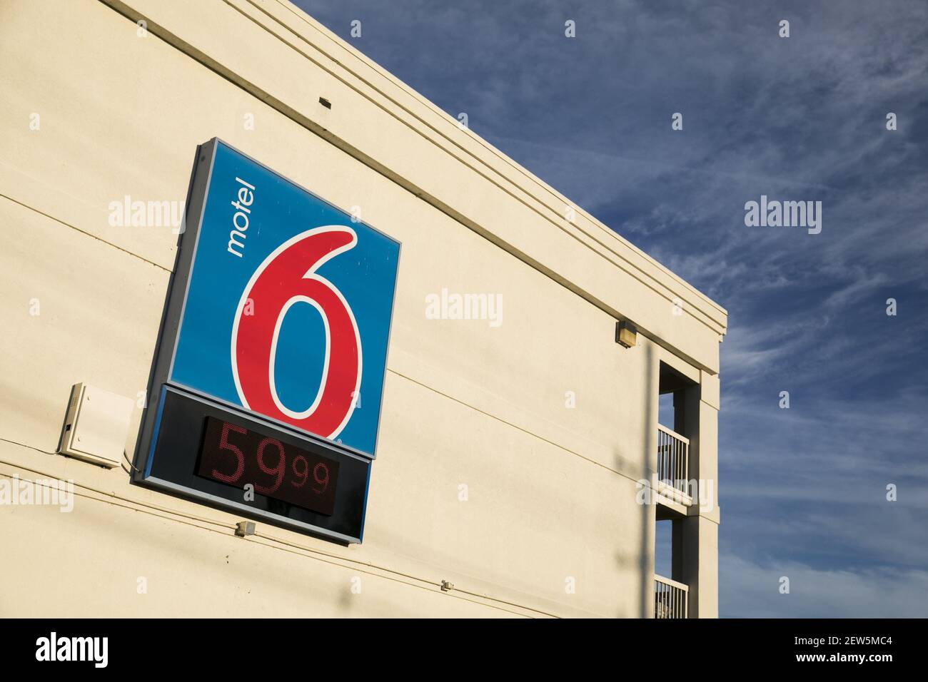 A logo sign outside of a Motel 6 location in Frederick, Maryland on ...