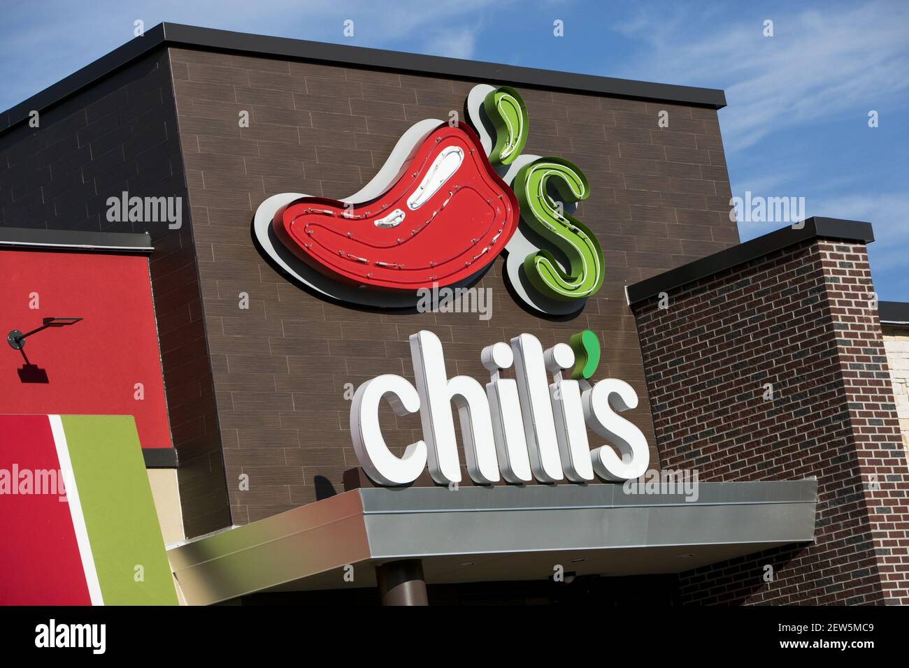 A logo sign outside of a Chili's Grill & Bar restaurant location in ...
