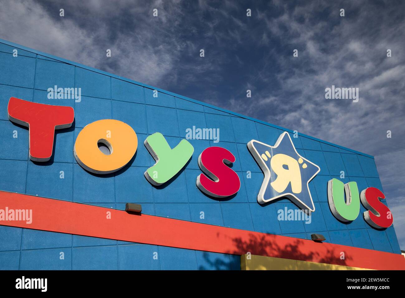 A logo sign outside of a Toys "R" Us retail store in Frederick ...