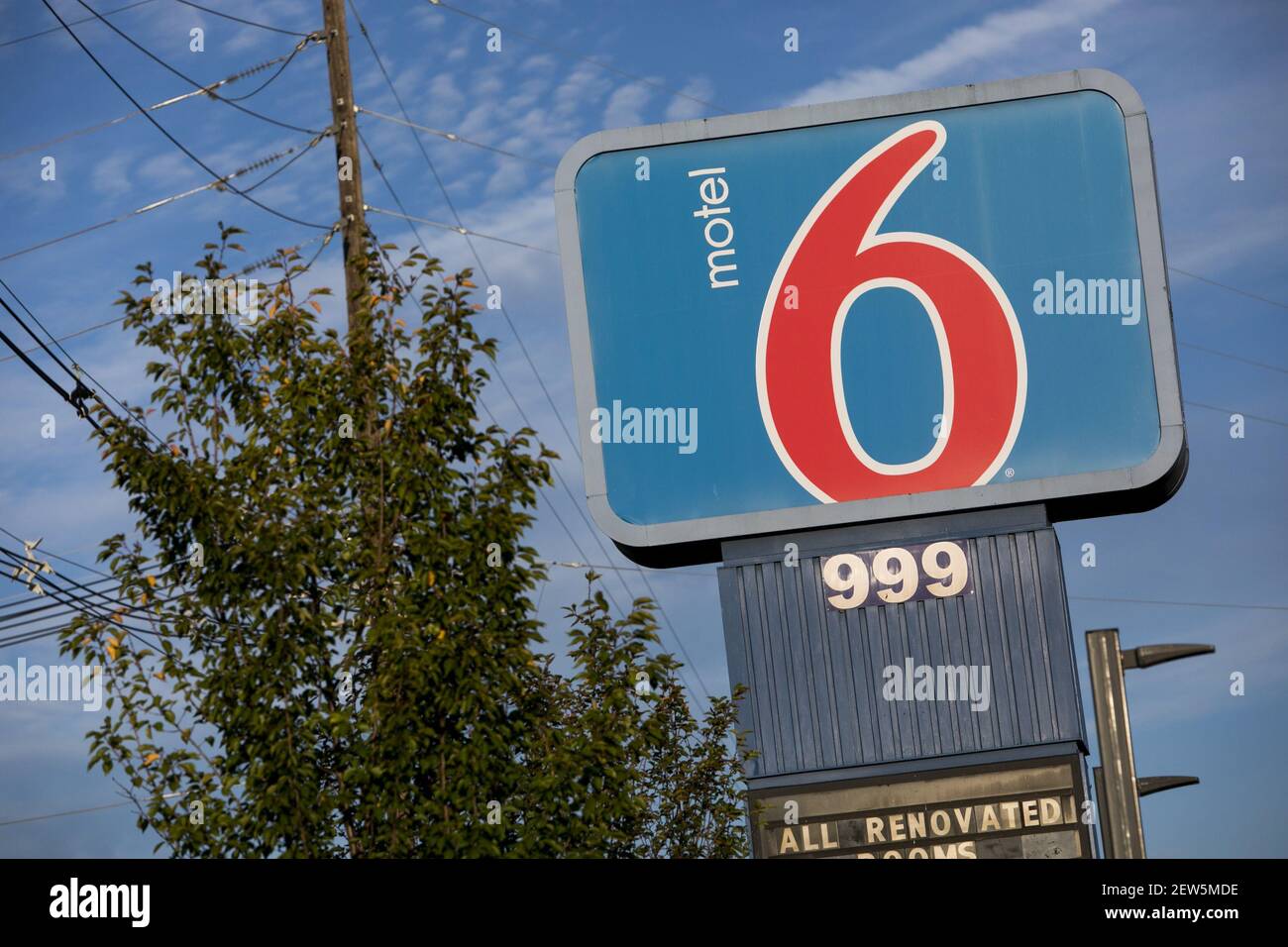 A logo sign outside of a Motel 6 location in Frederick, Maryland on ...