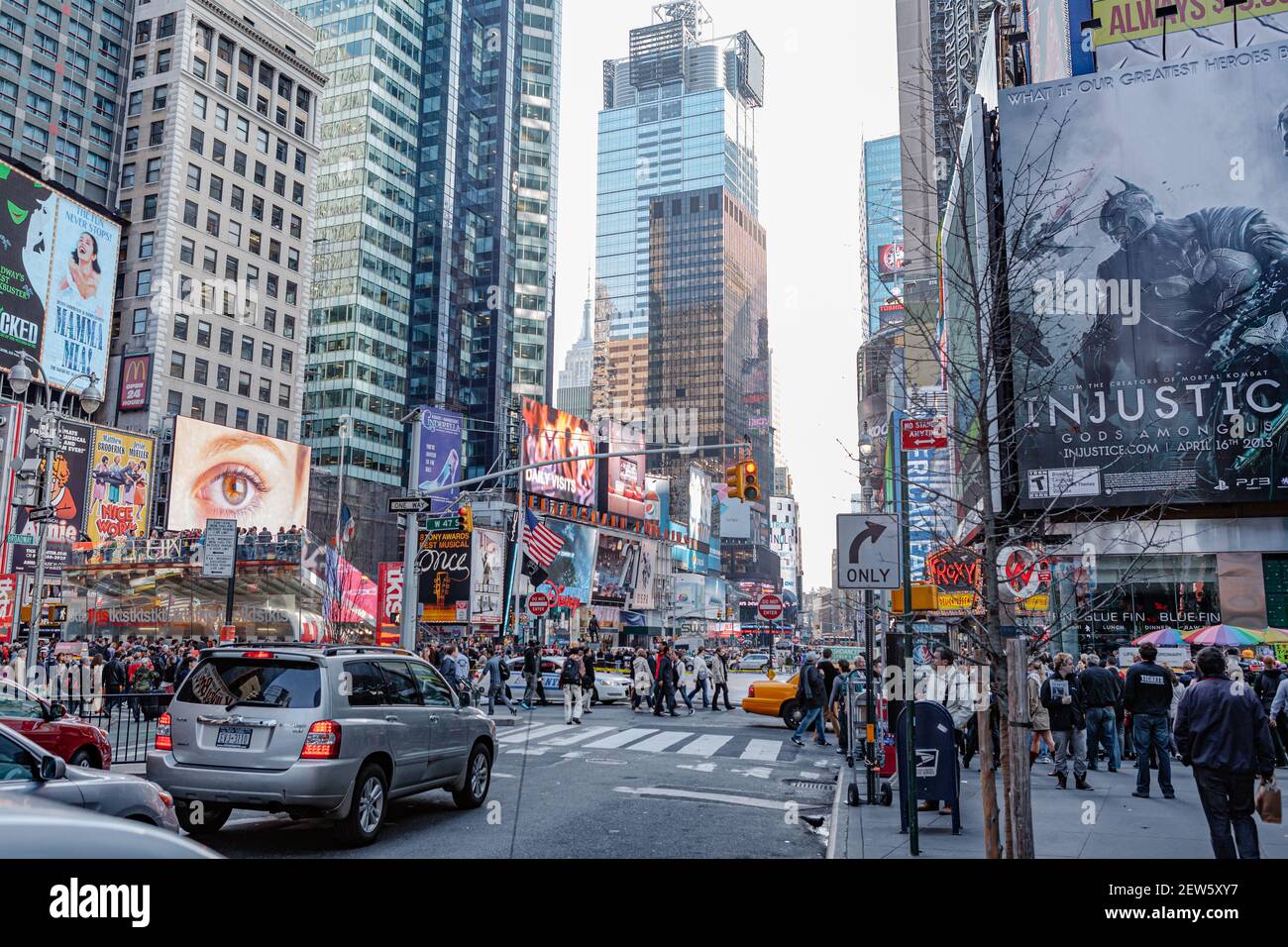 A wide view of times square at day time with people and cars Stock ...