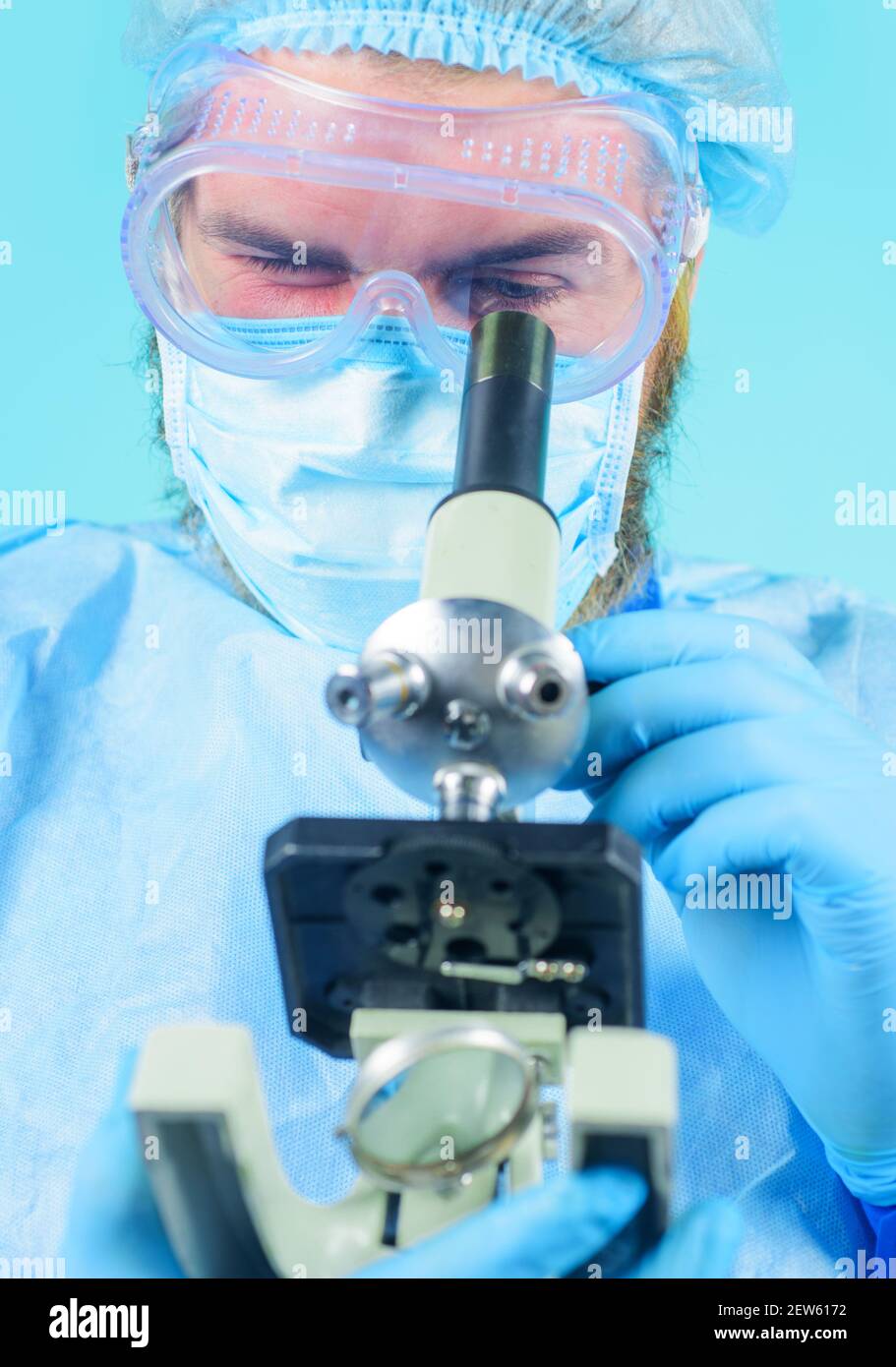 Scientist with microscope making test or research. Doctor using ...