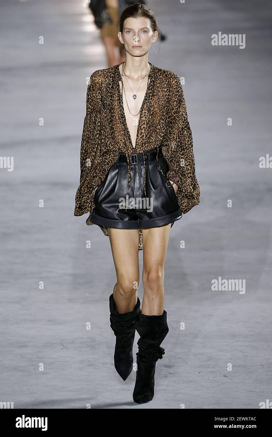 Model Luca Gajdus walks on the runway during the Saint Laurent Fashion ...