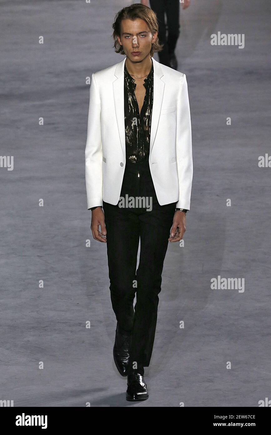 Model Paul Hameline walks on the runway during the Saint Laurent ...
