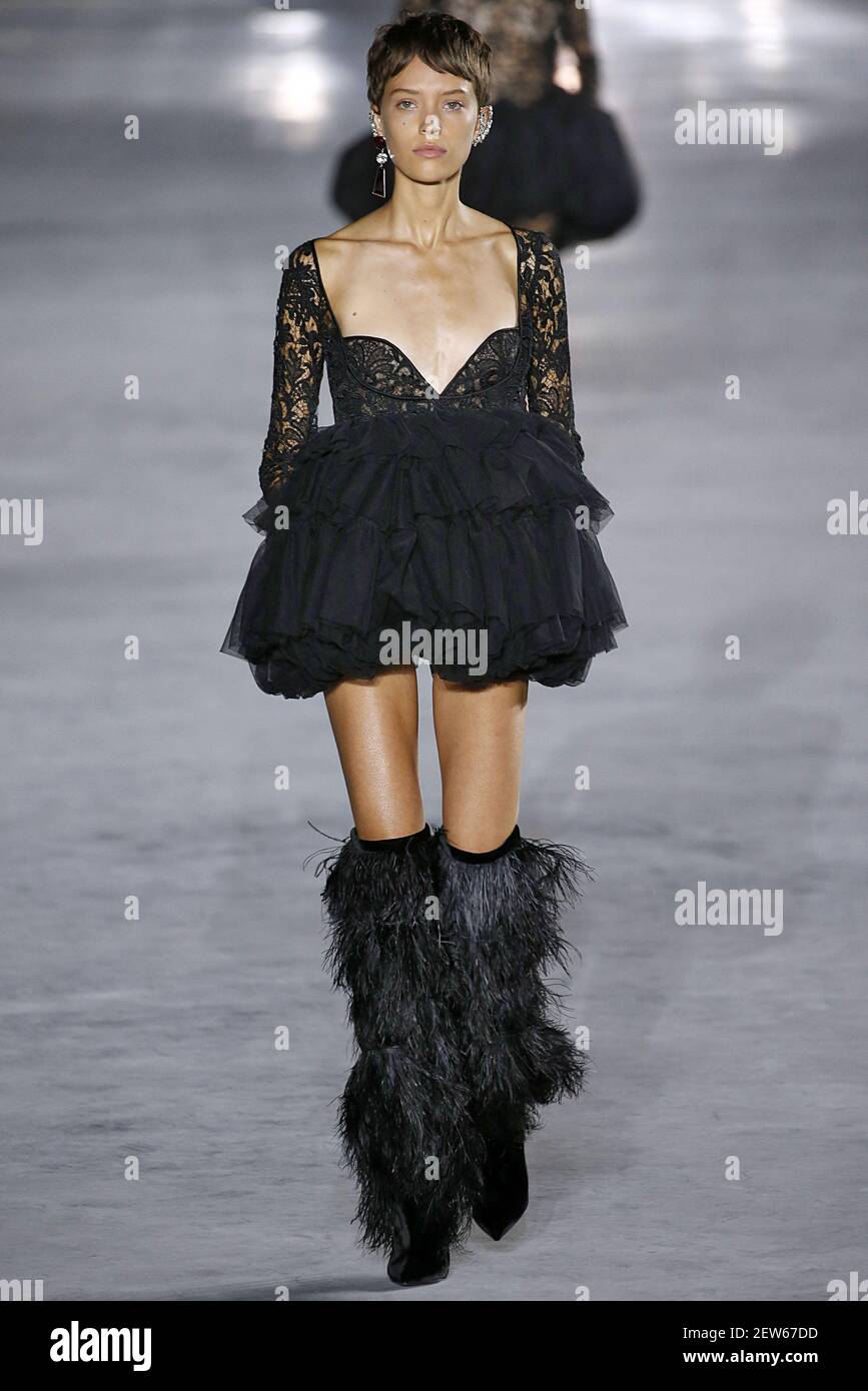 Model Loane Normand walks on the runway during the Saint Laurent ...