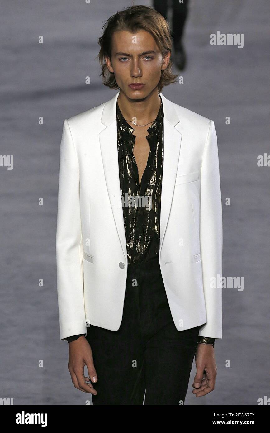 Model Paul Hameline walks on the runway during the Saint Laurent ...