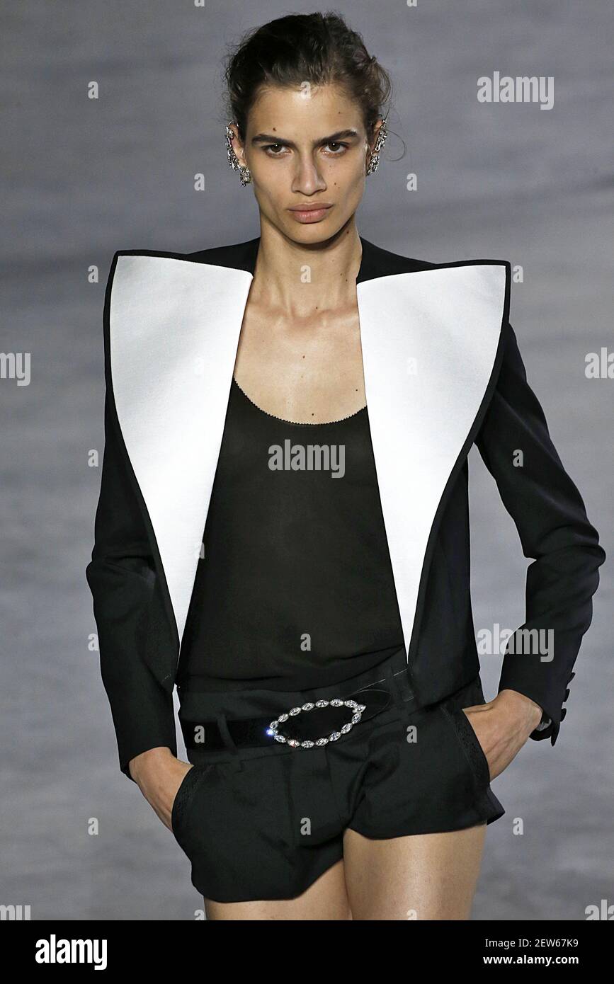 Model Linda Helena walks on the runway during the Saint Laurent Fashion ...