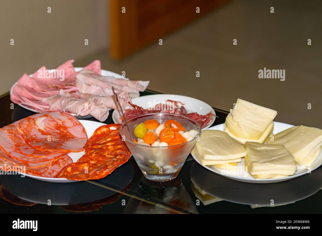 Preparing raclete swish dish, also popular in Savoie, France, based on ...