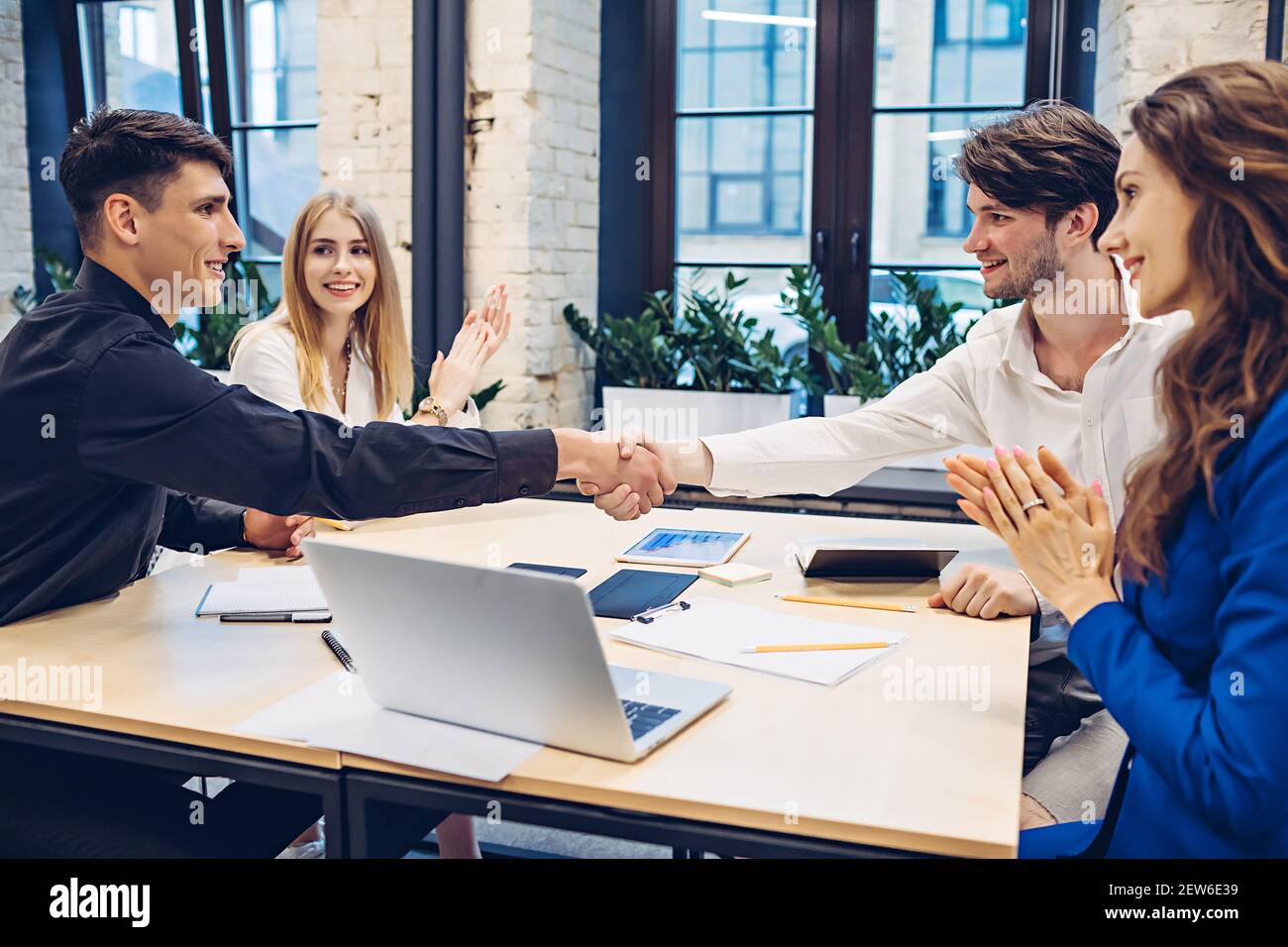businessmen shaking hands in office Stock Photo - Alamy