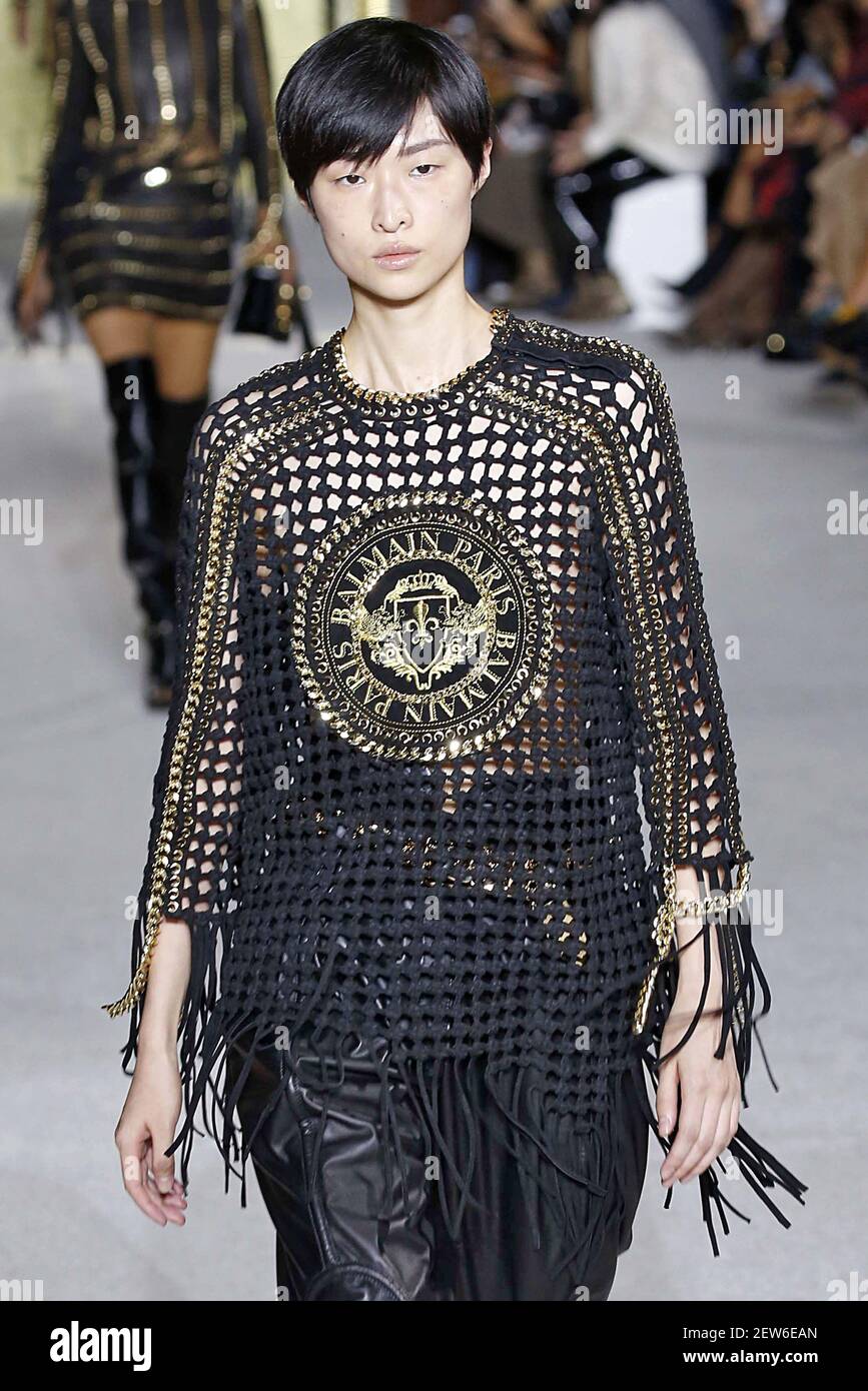 Model Chu Wong walks on the runway during the Balmain Fashion Show ...
