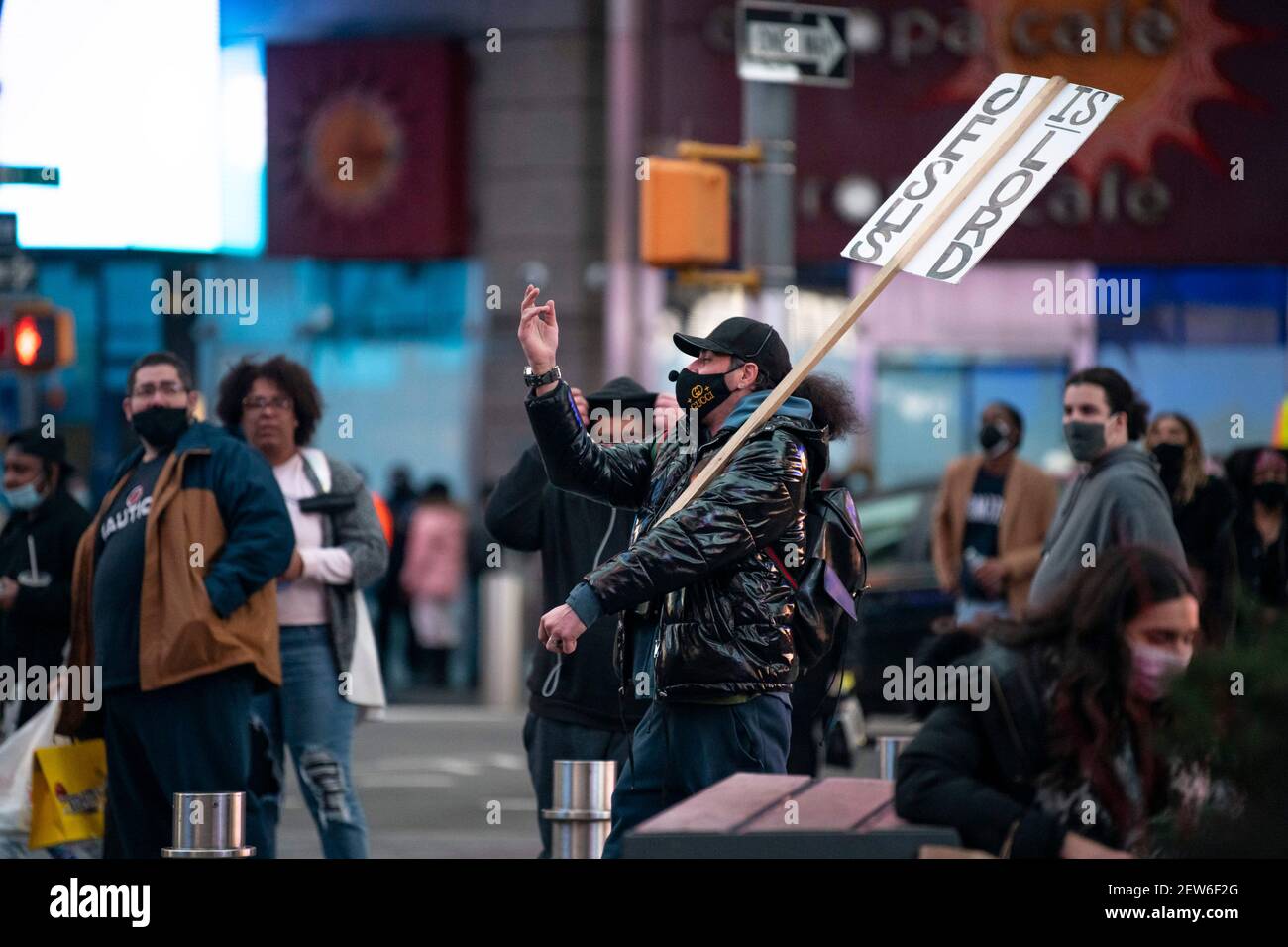 February 28, 2021: A preacher wearing a Gucci PPE mask walks through ...