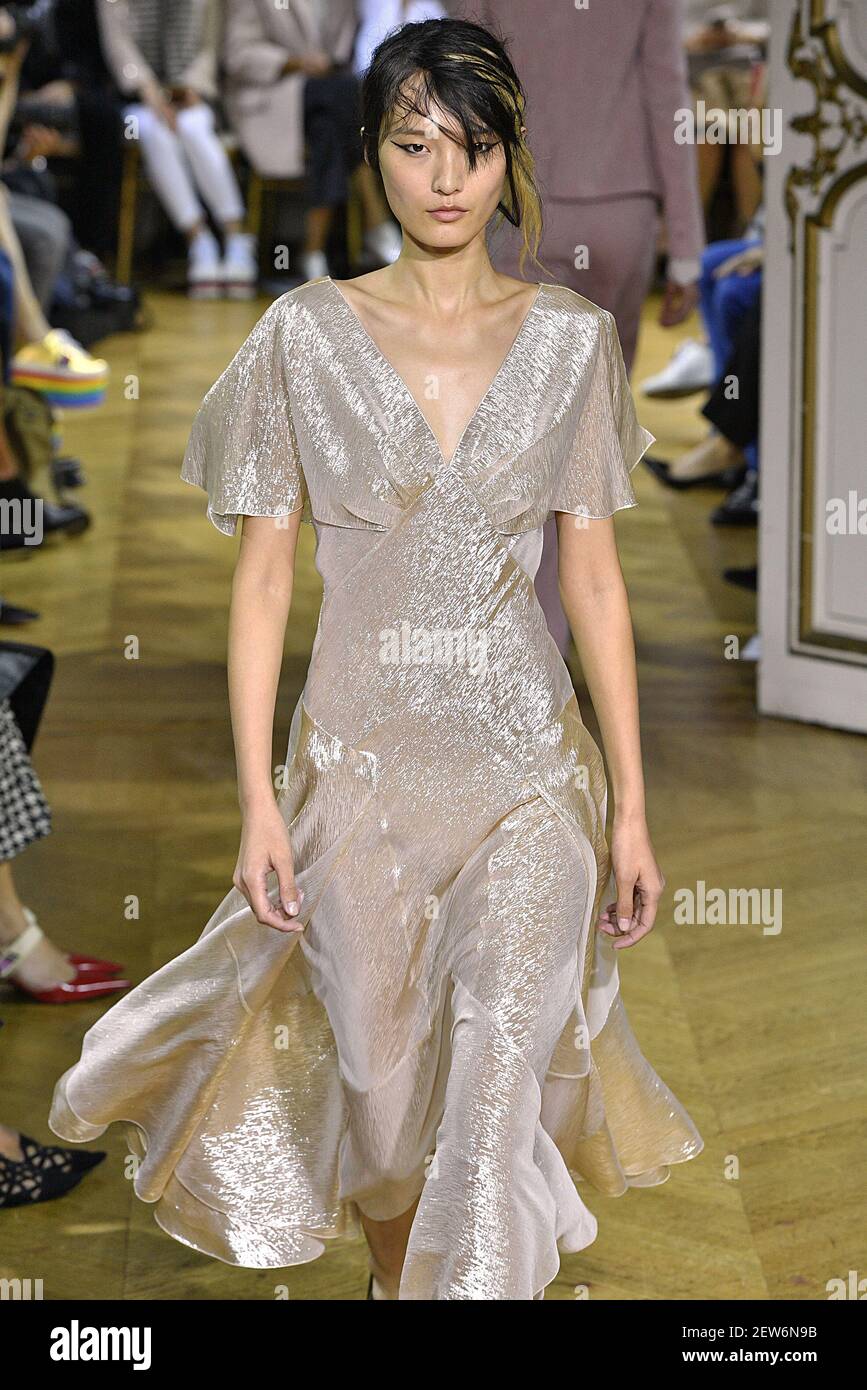 Model Liu Chunjie walks on the runway during the John Galliano Fashion ...