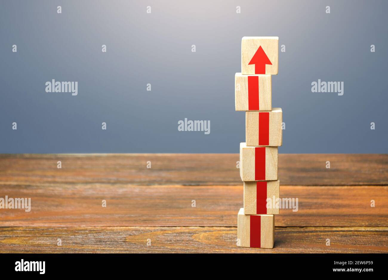 Block tower with red arrows. Business growth and development concept ...