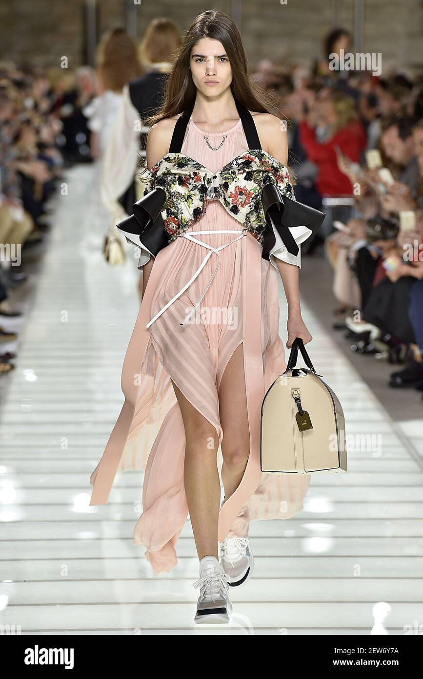 Model Alexandra Micu walks on the runway during the Louis Vuitton ...