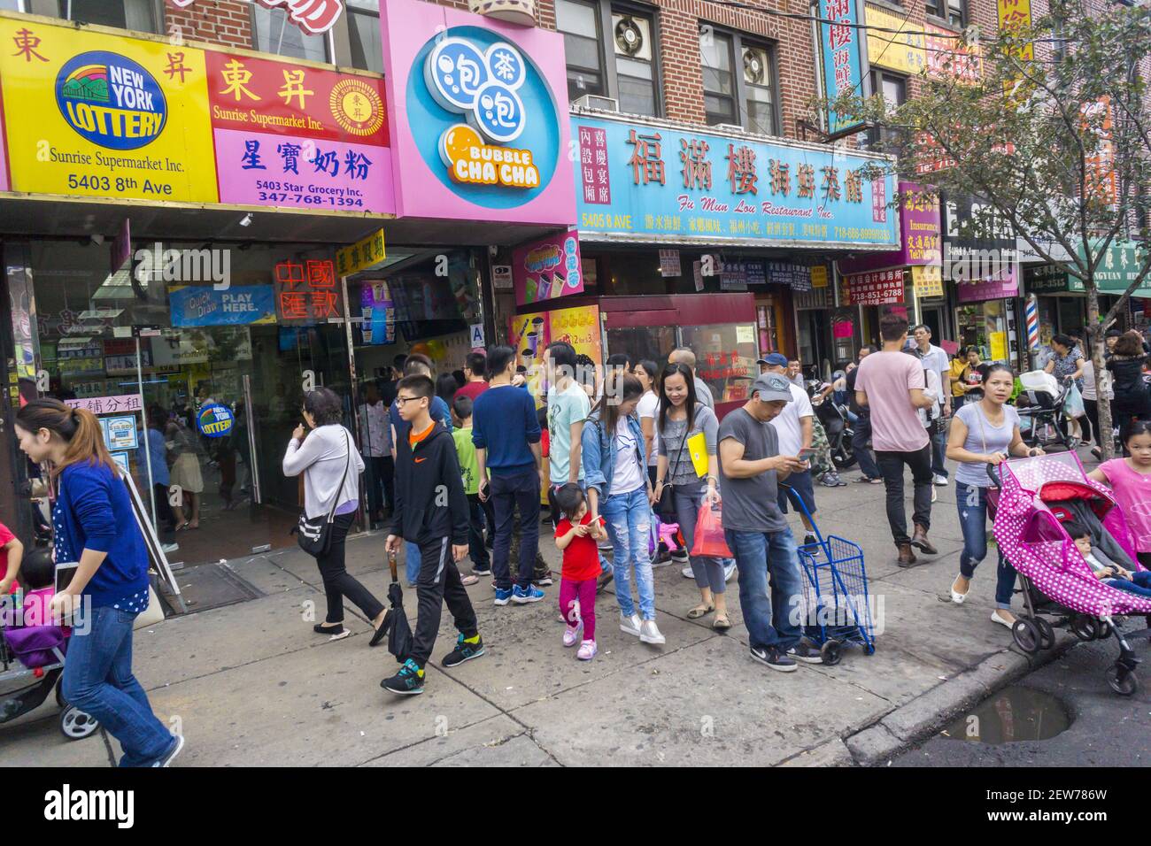 People line up for bubble tea on Eighth Avenue in the Sunset Park neighborhood in Brooklyn in ...