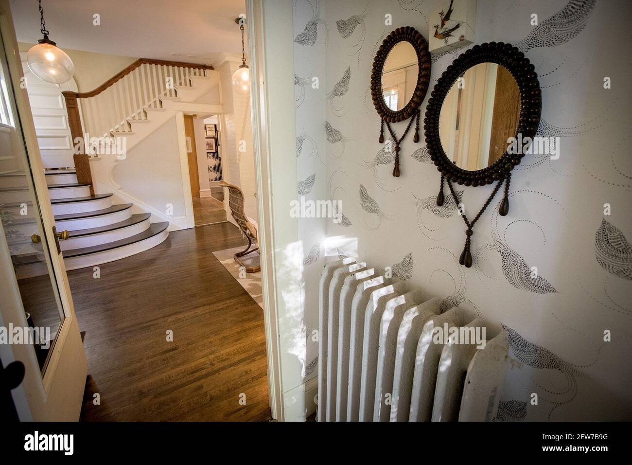 Pajarito wallpaper brightens up the front entry.(Elizabeth Flores ...