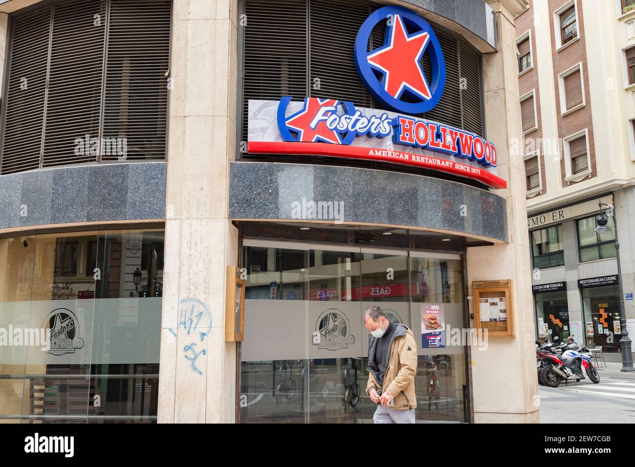 A man walks past the Foster´s Hollywood fast food restaurant Stock ...
