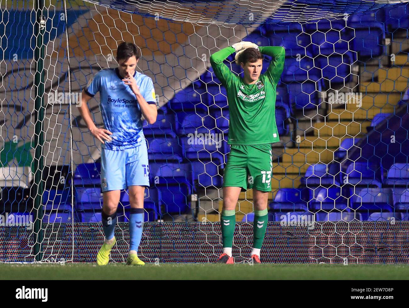 Coventry City goalkeeper Ben Wilson reacts after conceding a second ...