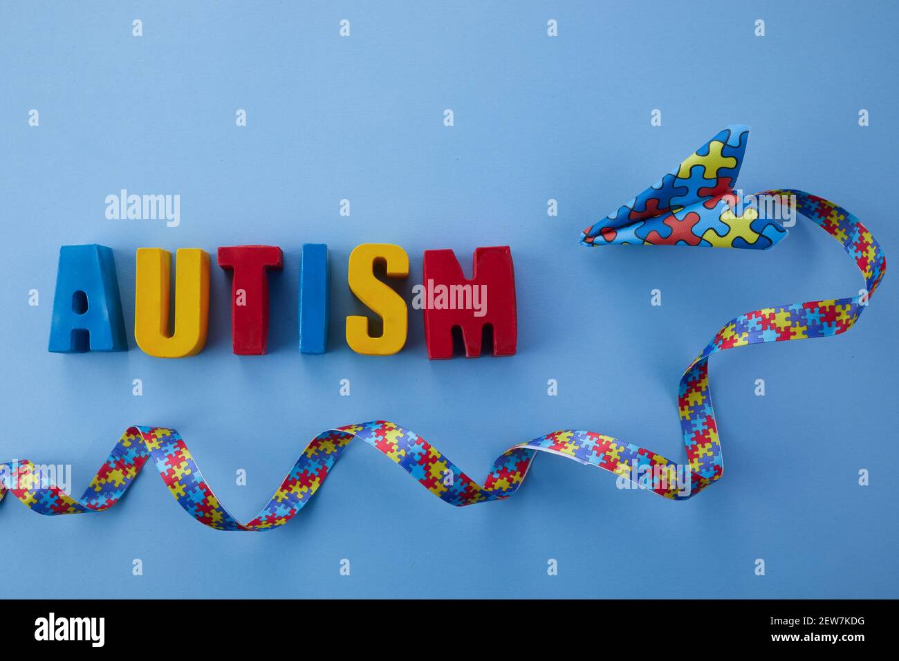 Autism awareness. paper plane in origami style with autism awareness ...