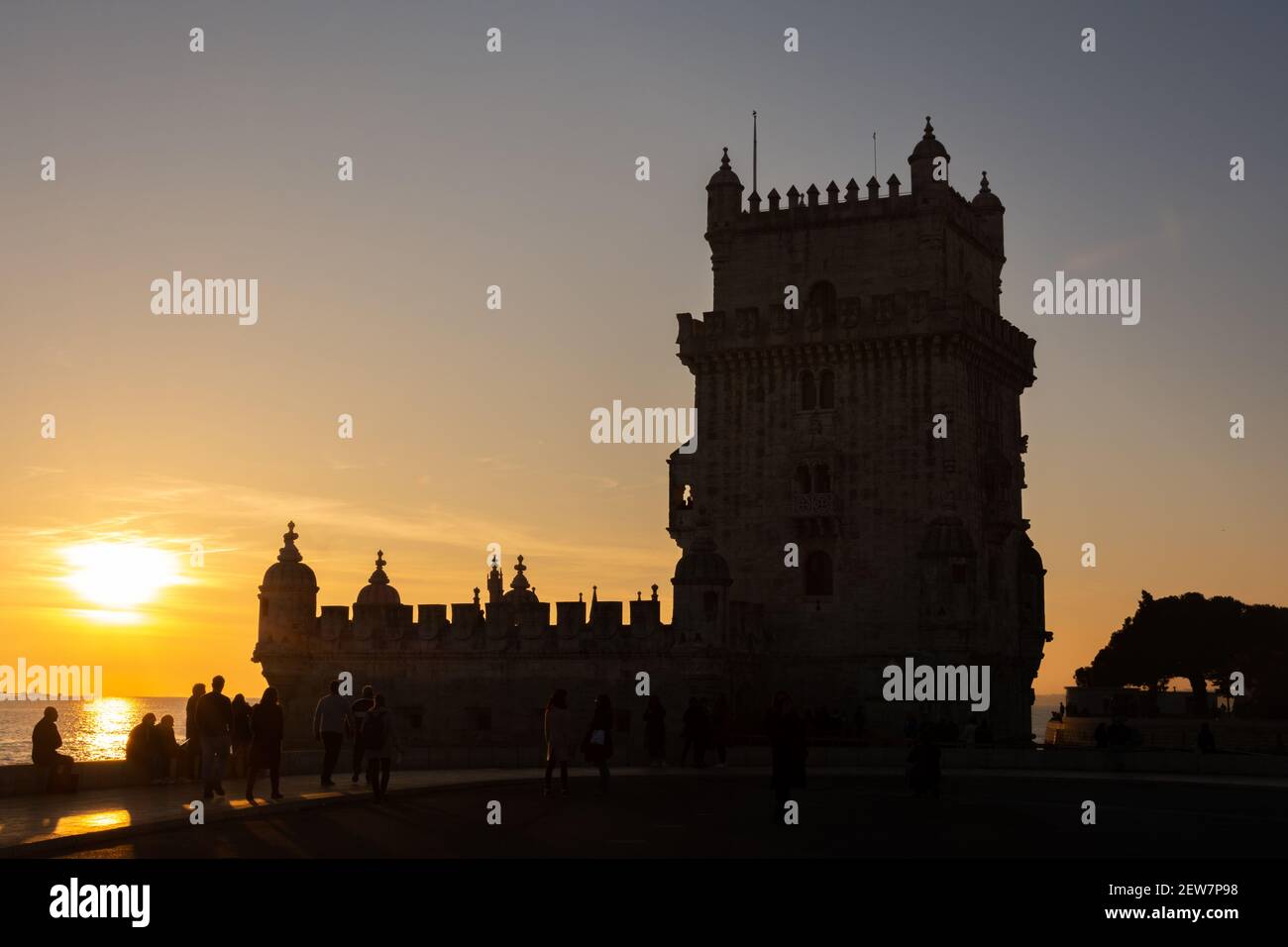 People walking in a famous and touristic place in Lisbon , Belém Tower ...