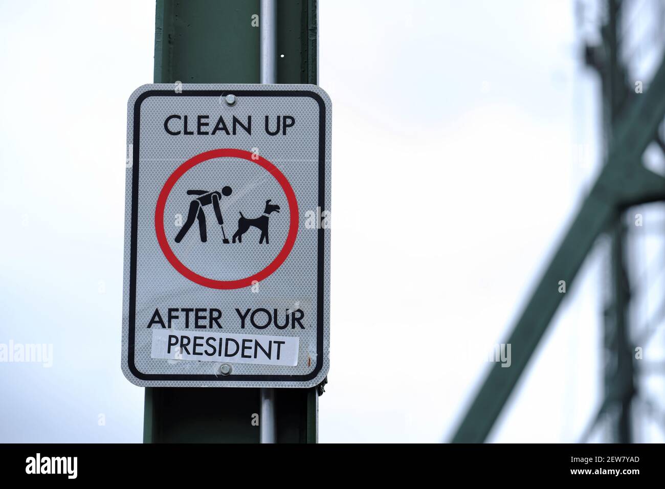 A modified sign reads "Clean Up After Your President" on the Hawthorne ...