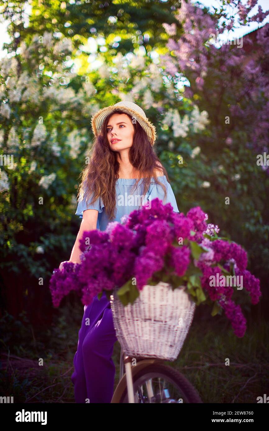 Portrait of a happy beautiful young girl with vintage bicycle and ...