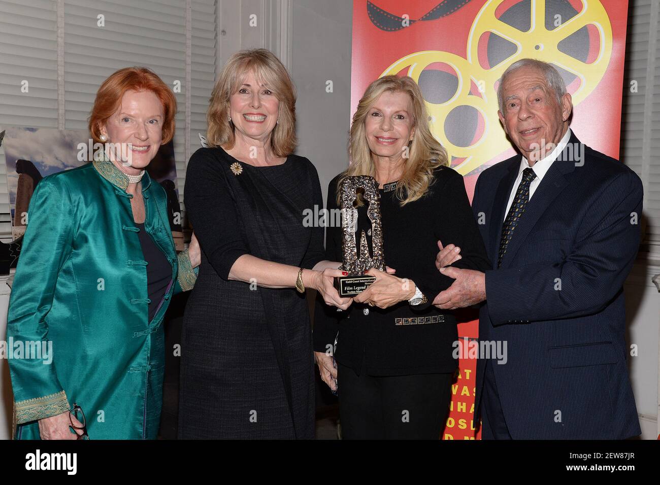 (L-R) Princess Yasmin Aga Khan (second from right) accepts the first ...