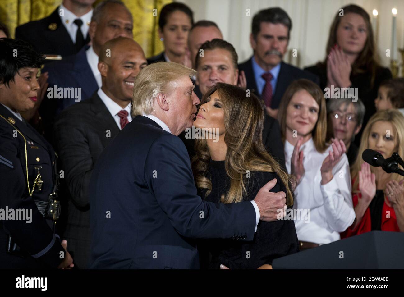 United States President Donald J. Trump hugs first lady Melania Trump ...