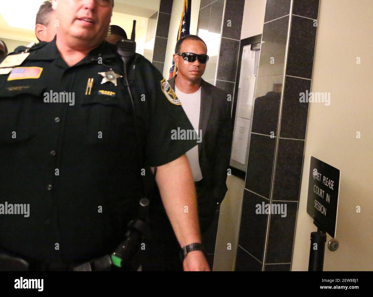 Golfer Tiger Woods makes his way into a North County Courthouse ...