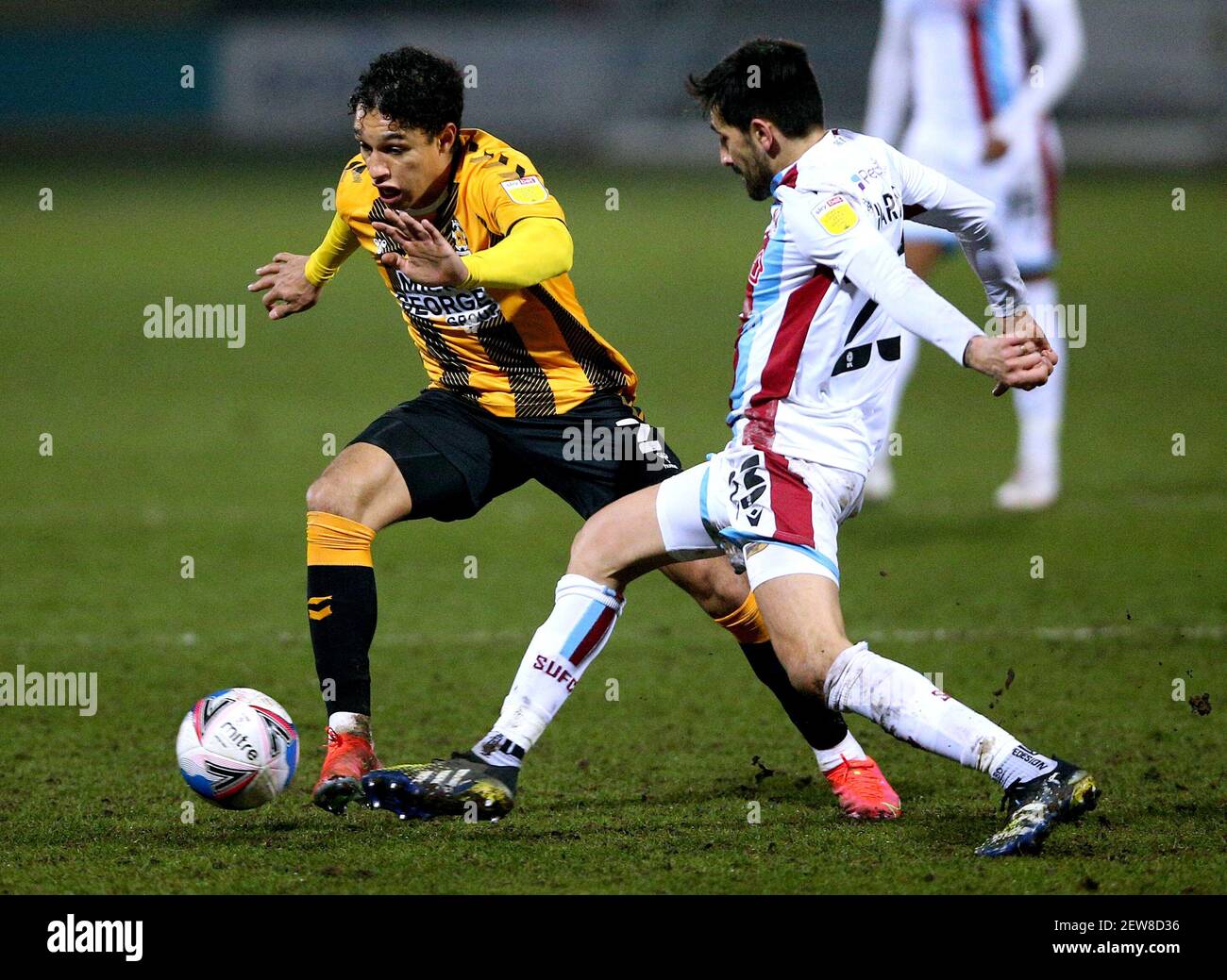 Cambridge United's Kyle Knoyle (left) and Scunthorpe United's Jem ...