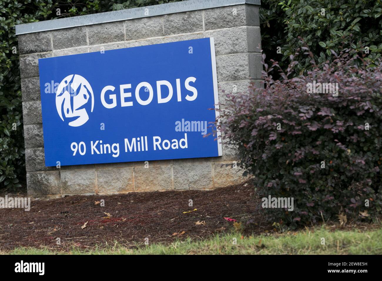 A logo sign outside of a facility occupied by Geodis in McDonough ...