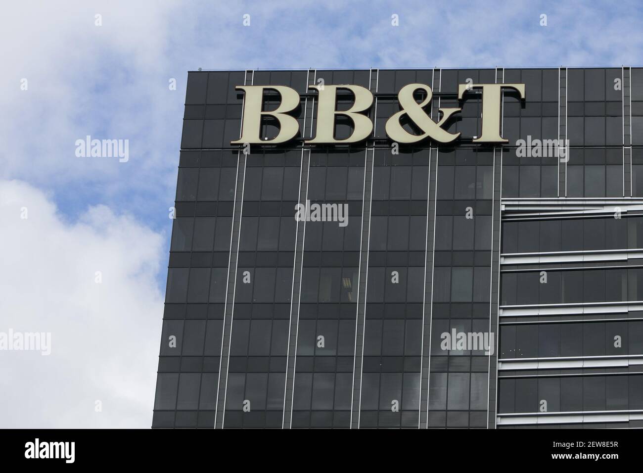 A logo sign outside of a facility occupied by the BB&T Corporation in ...