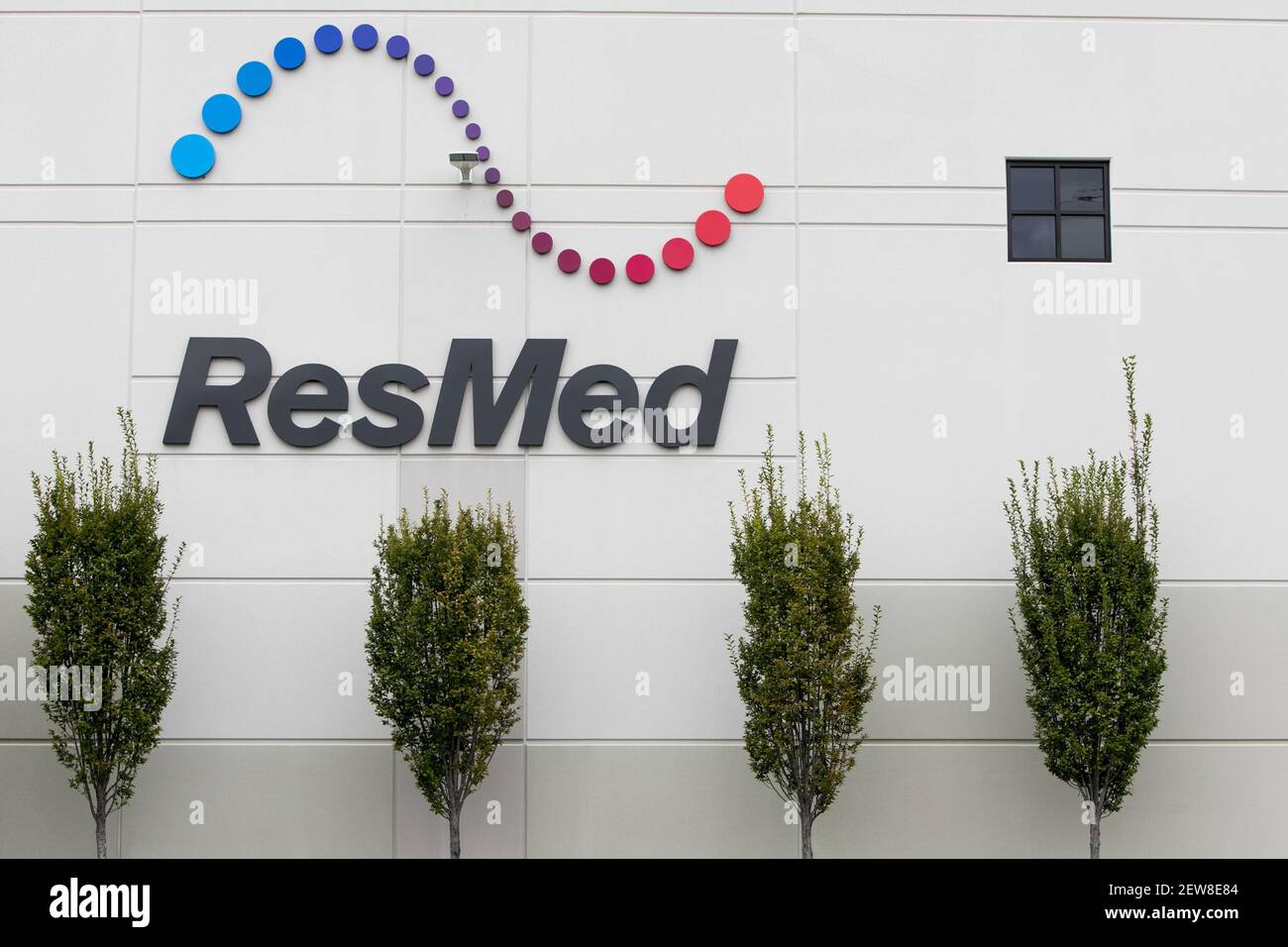 A logo sign outside of a facility occupied by ResMed in Lithia Springs ...