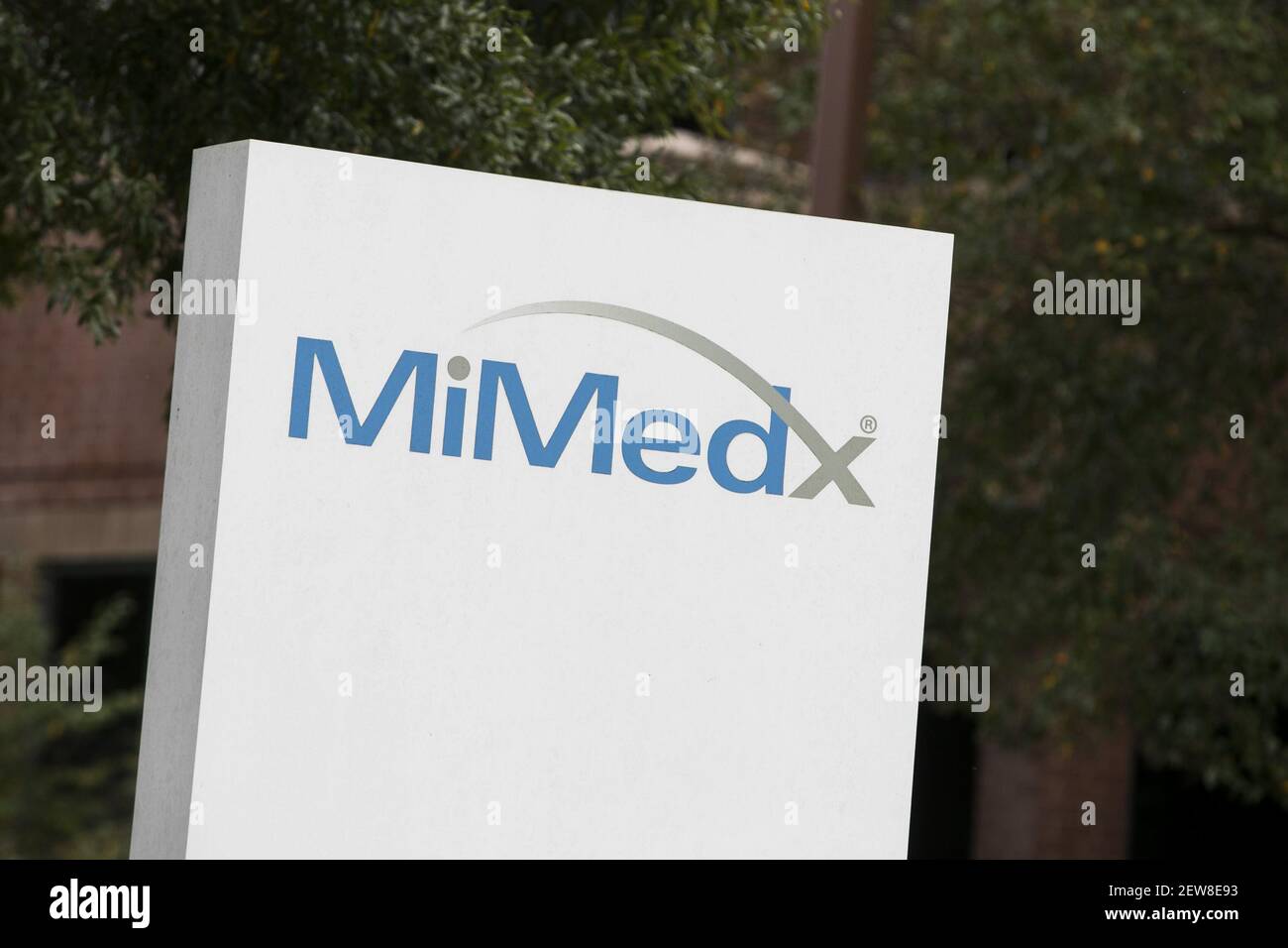 A logo sign outside of the headquarters of MiMedx in Marietta, Georgia ...