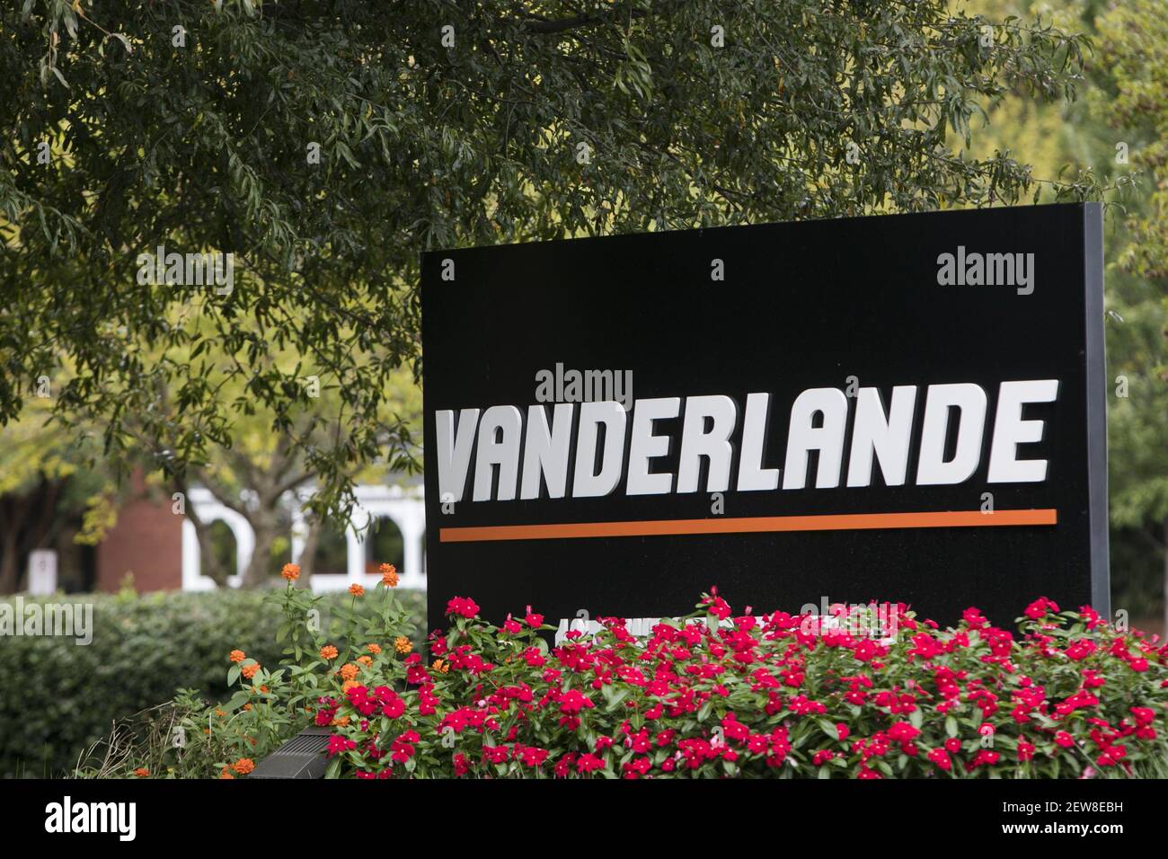 A logo sign outside of a facility occupied by Vanderlande Industries in ...