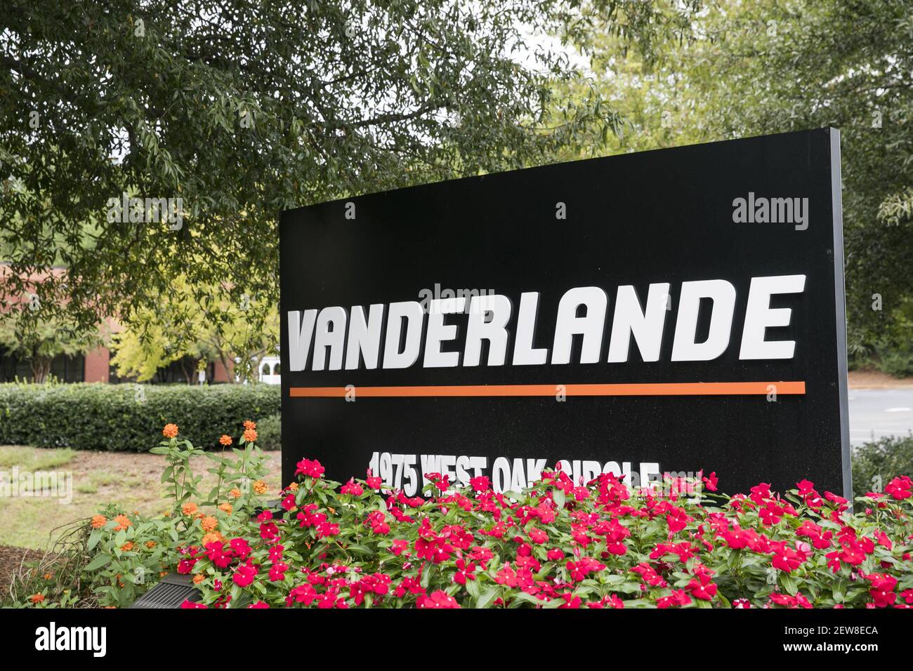 A logo sign outside of a facility occupied by Vanderlande Industries in ...